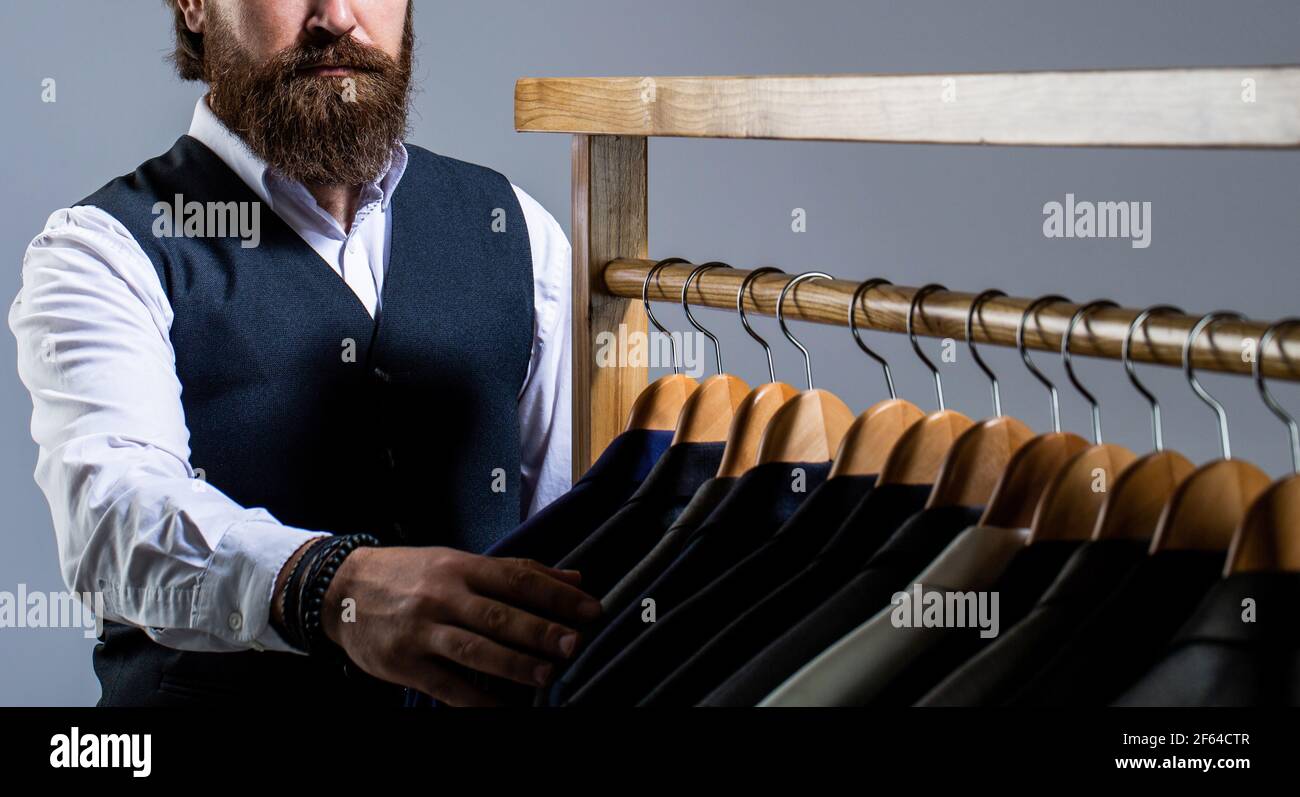 Tailor, tailoring. Stylish men's suit. Handsome bearded fashion man in ...