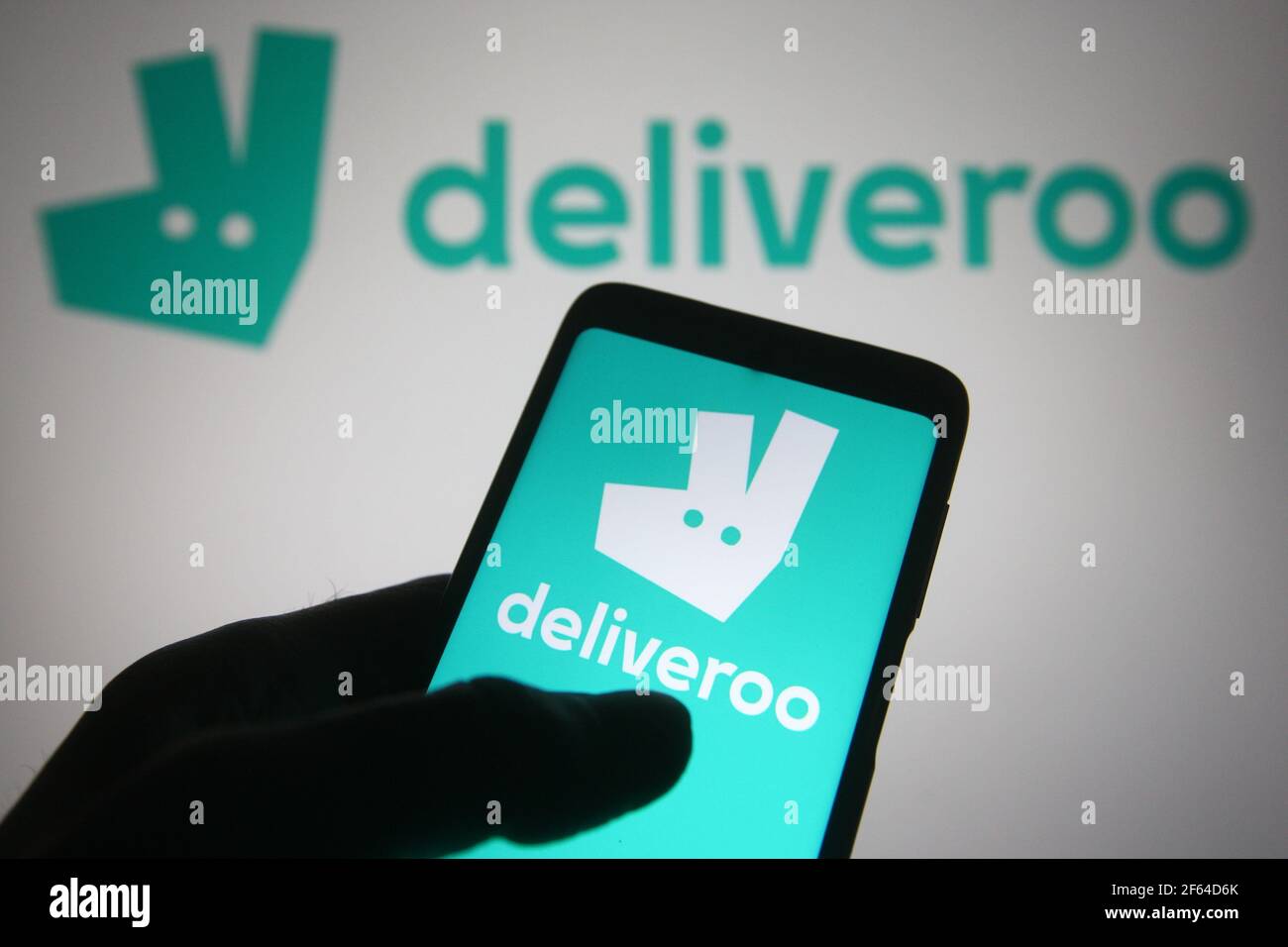 In this photo illustration the Deliveroo logo of an online food ...