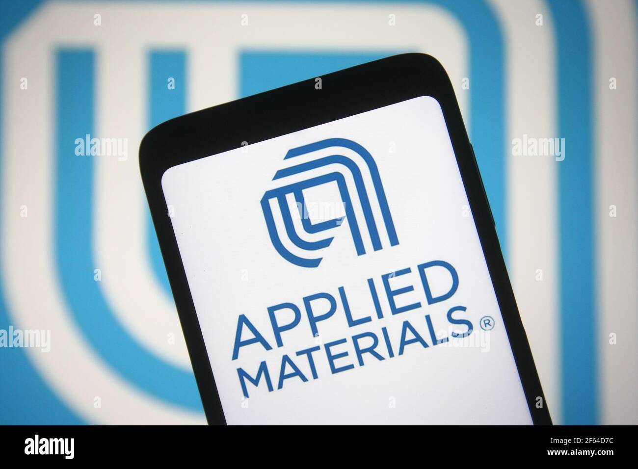 In this photo illustration the Applied Materials logo is seen on a ...