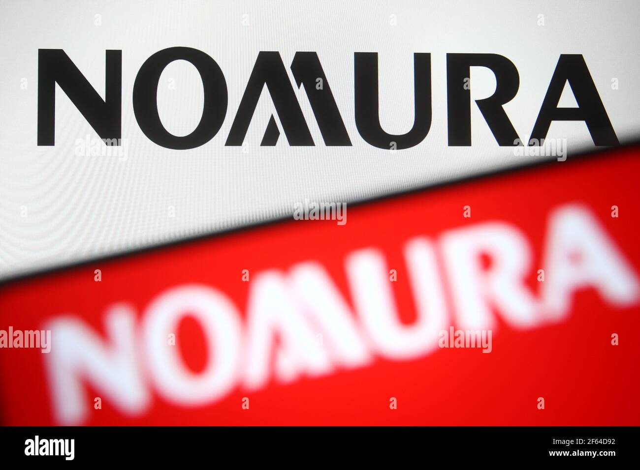 In this photo illustration the Nomura logo of an Japanese financial ...