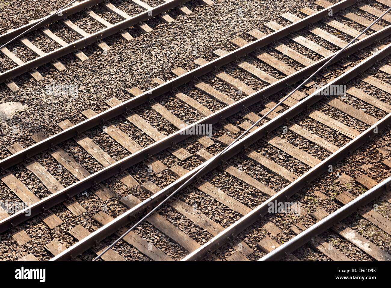 Rusty railroad tracks on gravel. Top view of railways on a sunny day ...