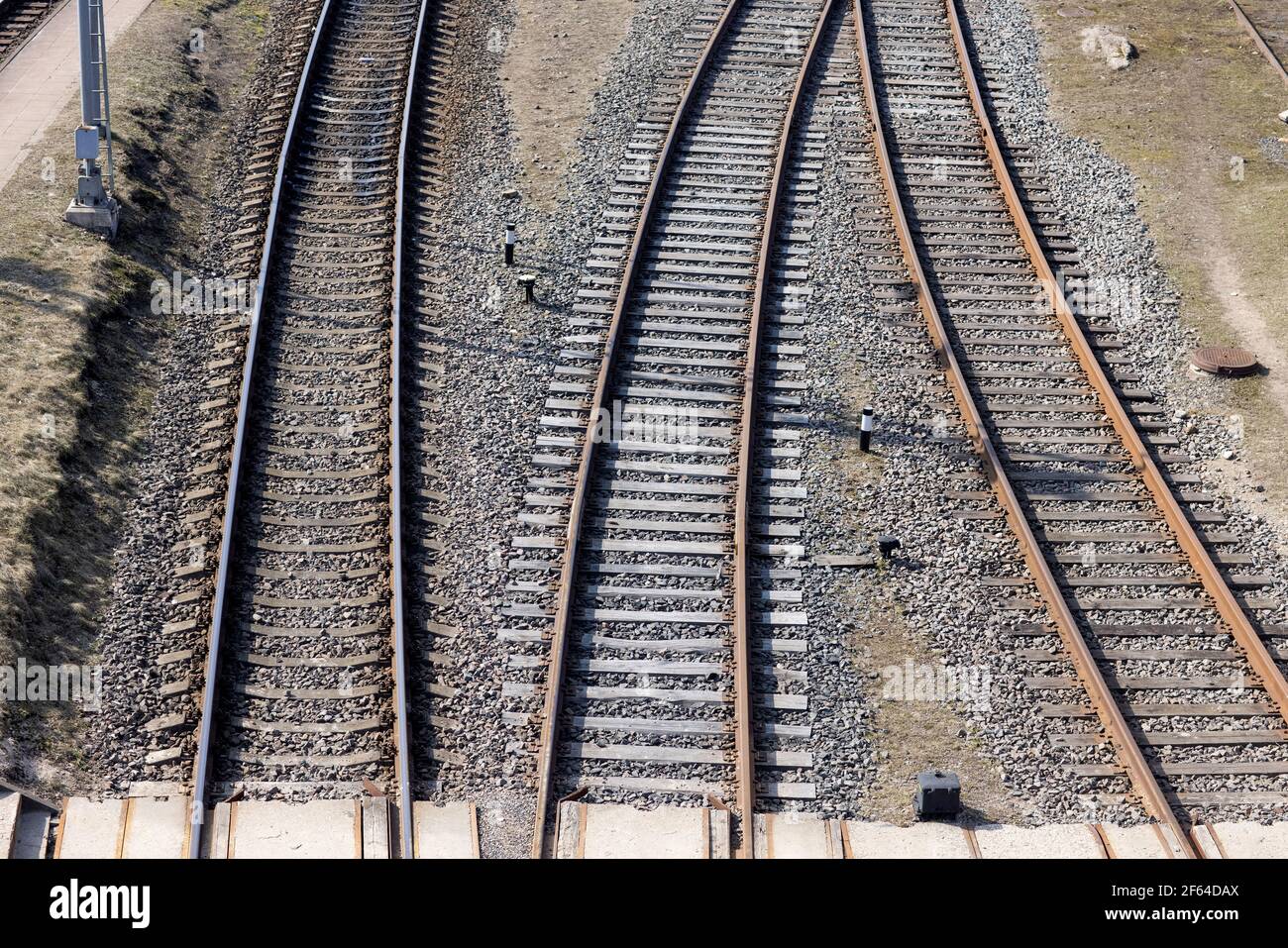 Rusty railroad tracks on gravel. Top view of railways on a sunny day ...