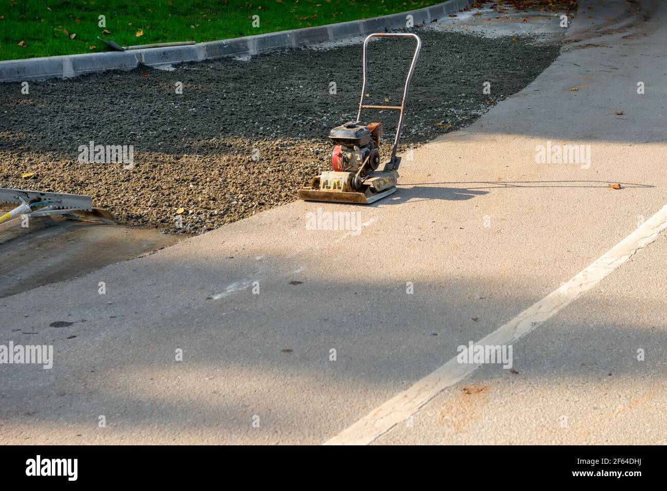 Asphalt vibratory plate compactor. Pothole repair process. Asphalt ...