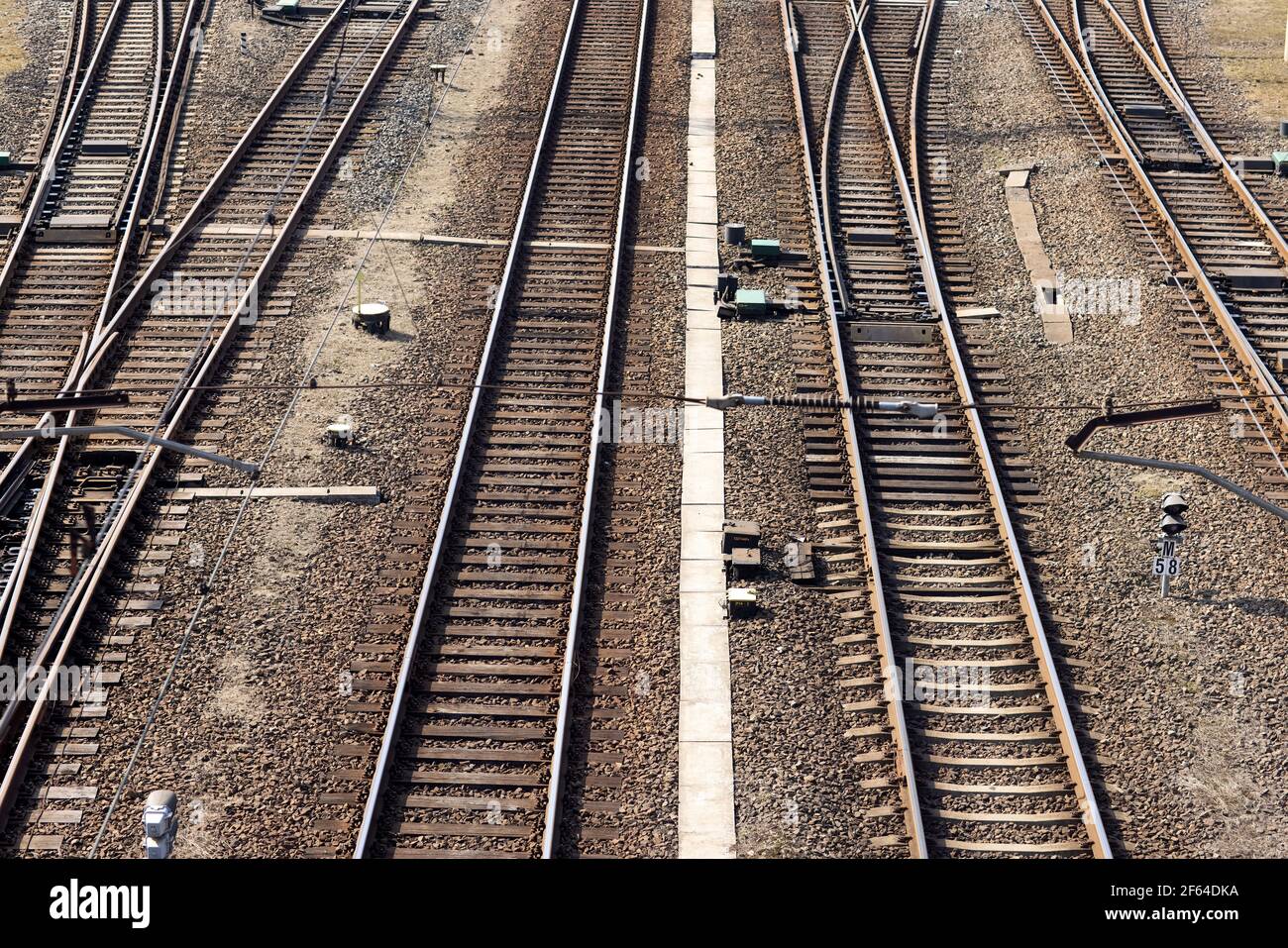 Rusty railroad tracks on gravel. Top view of railways on a sunny day ...