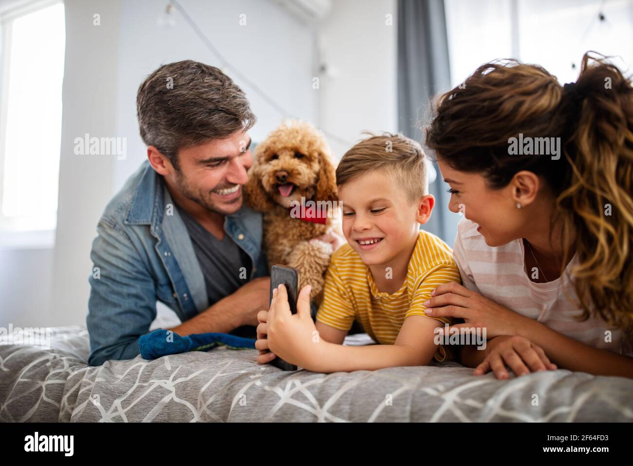 Happy family with pet hi-res stock photography and images - Alamy