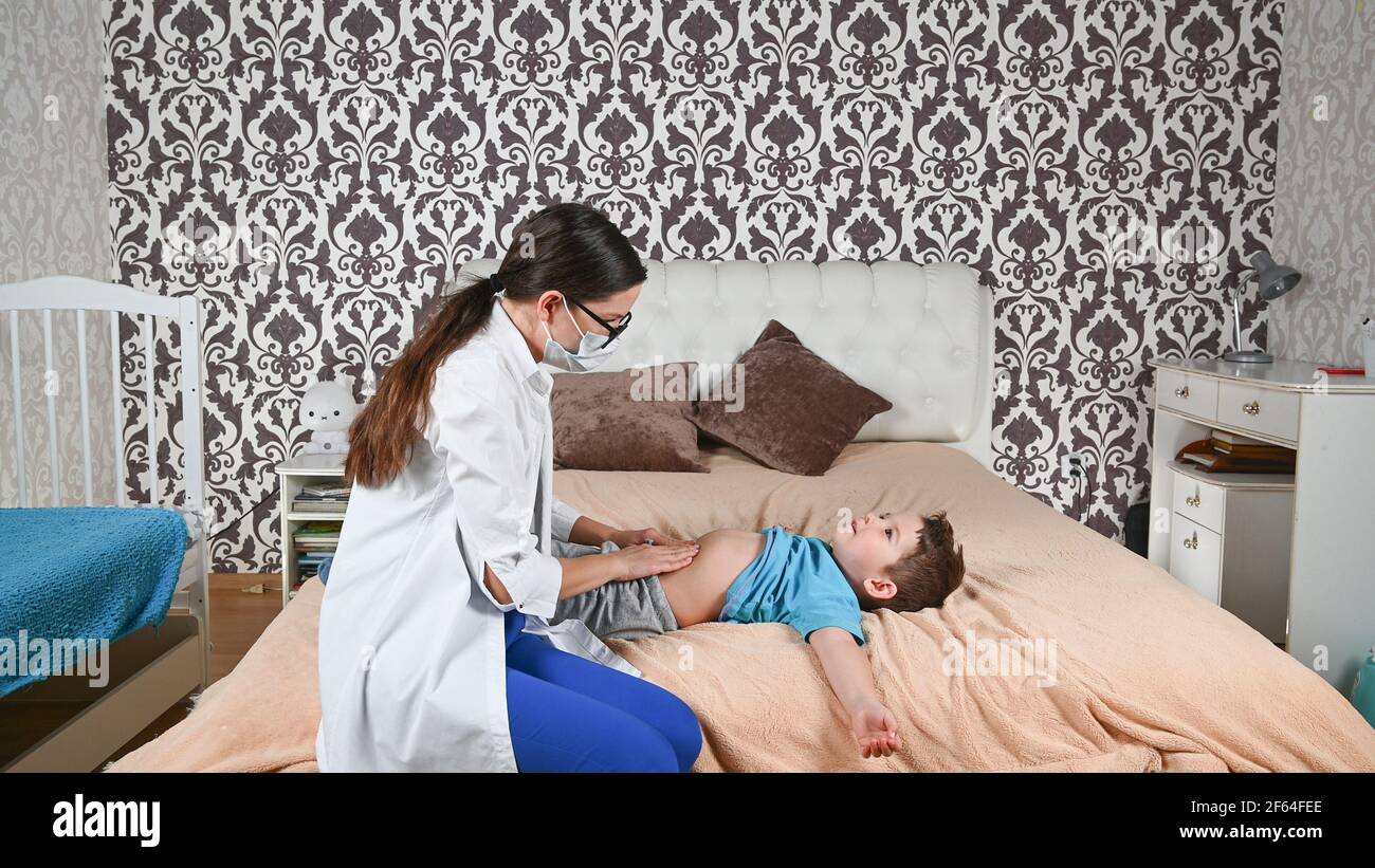 Doctor touching stomach mature patient hi-res stock photography and ...