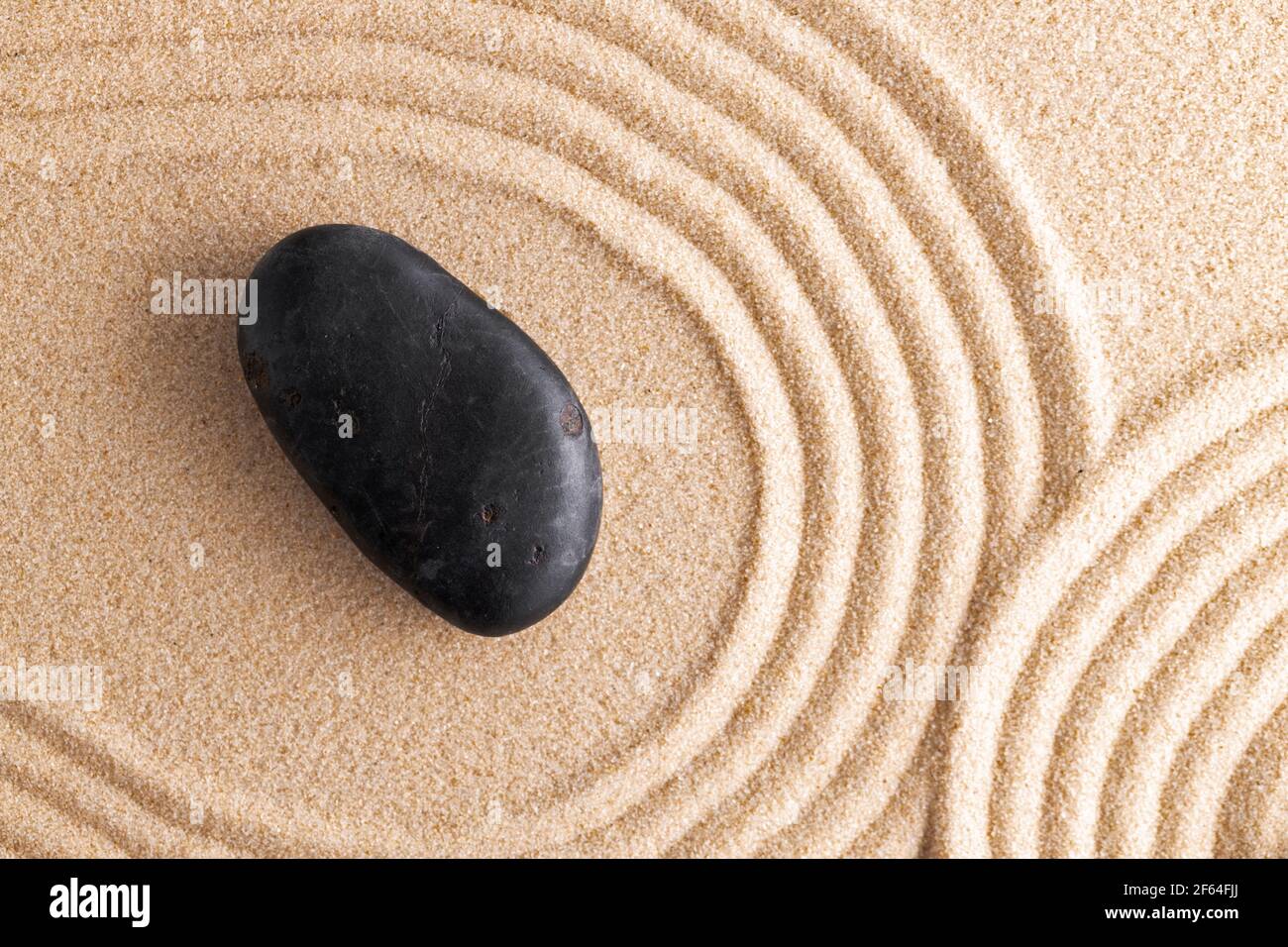 Japanese zen garden with stone in raked sand Stock Photo - Alamy