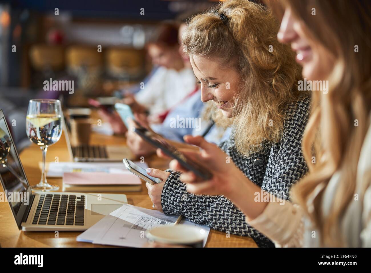 Cheerful people using smartphones hi-res stock photography and images ...