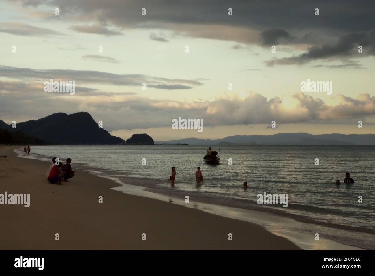 People having a leisure time on a sandy beach in Ao Khanom, Nakhon Si ...
