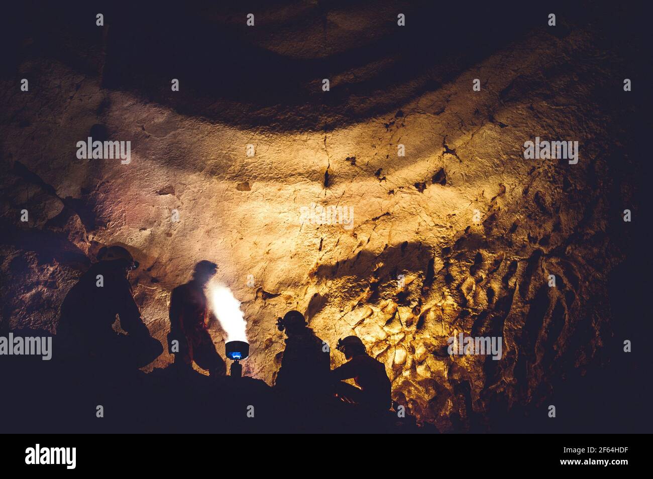 Spelunkers inside dark cave hi-res stock photography and images - Alamy