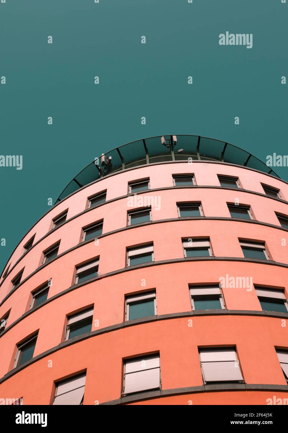 Pink gradient colored modern cylindrical residential building from ...