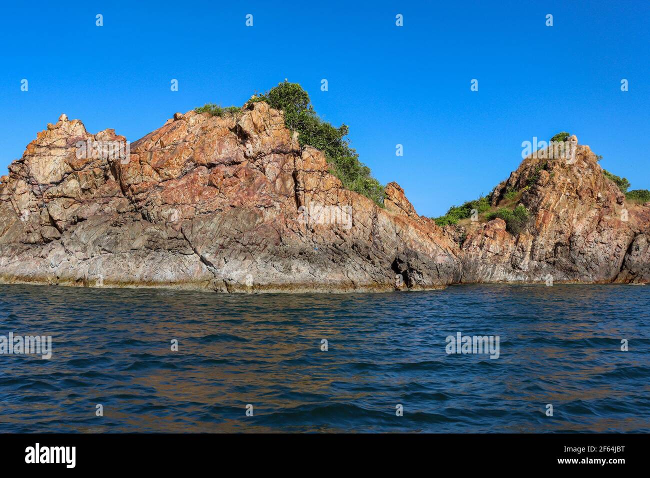also known as Golden Rocks, with early morning sun rays falling on the ...