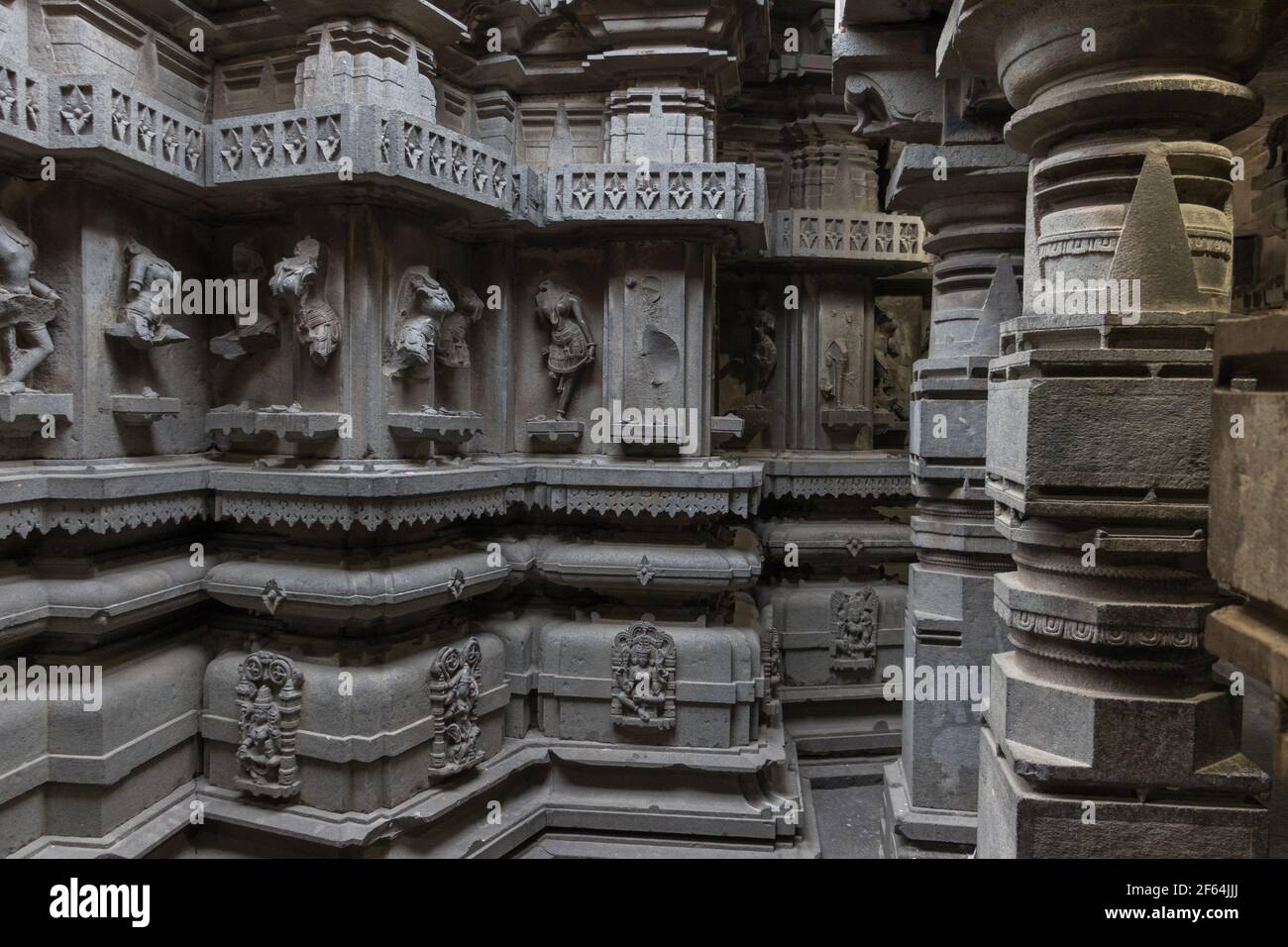 Headless sculptures hand carved in wall of old temple in india, black ...