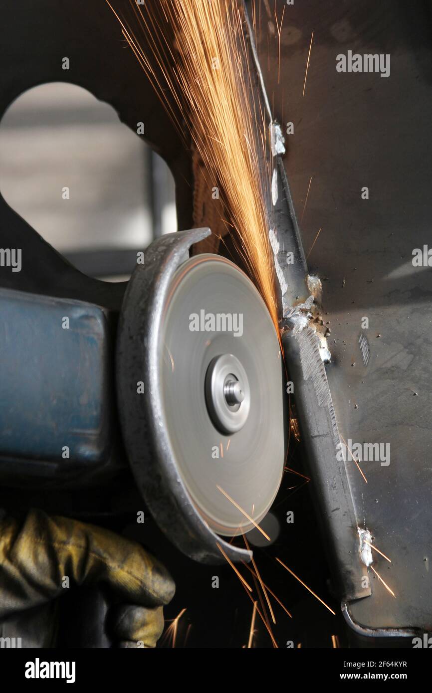 Steel cutter grinder and sparks in workshop Stock Photo - Alamy