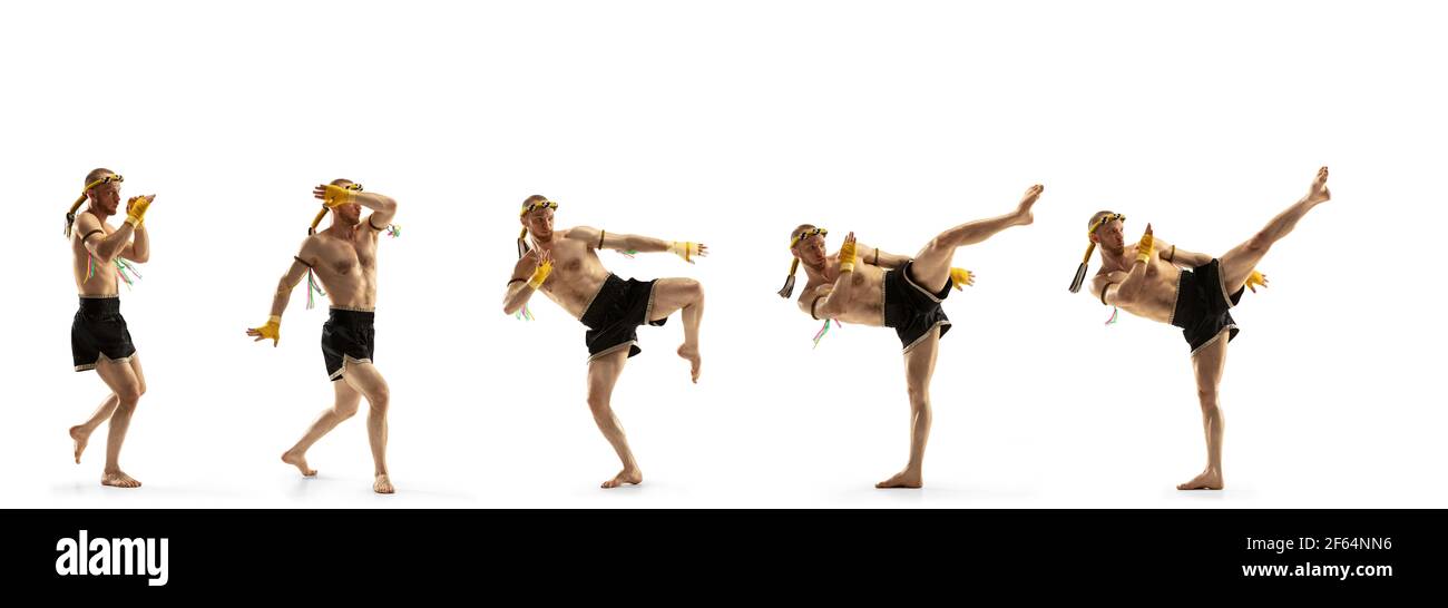 Young man thai boxer on white background in motion of step to step leg ...