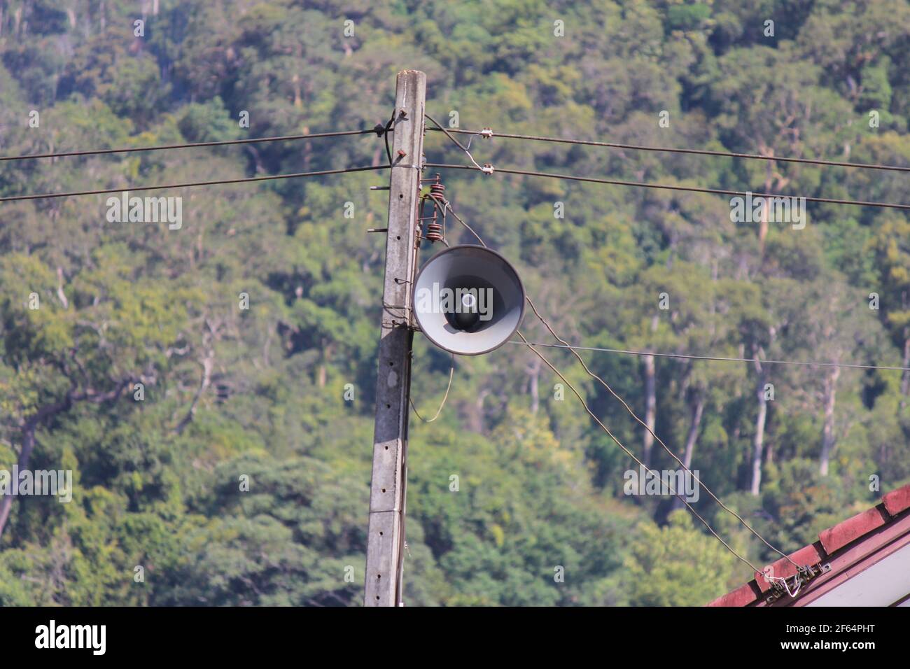 A big speaker on a pole to make an announcement in country side Stock ...