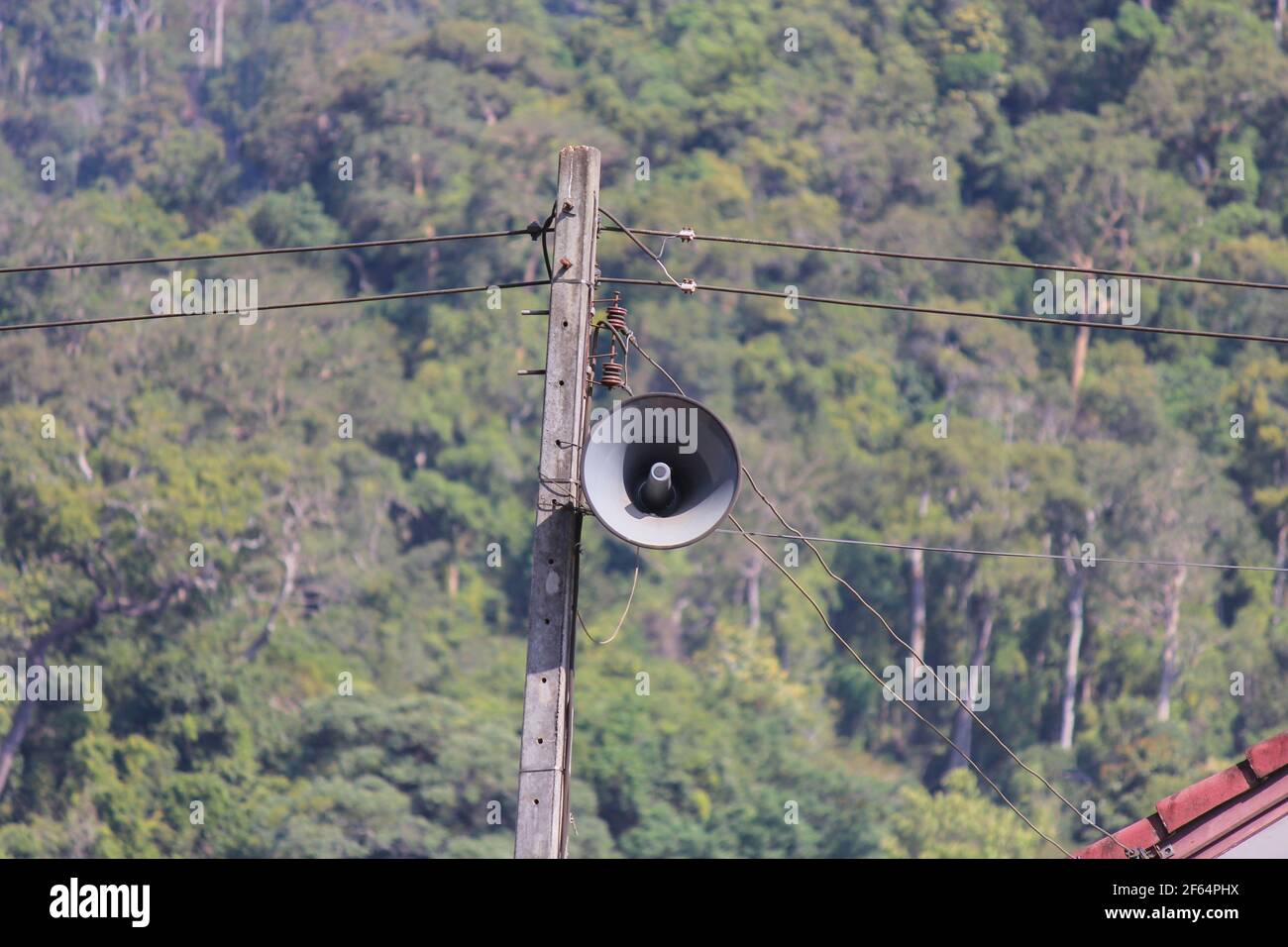 A big speaker on a pole to make an announcement in country side Stock ...