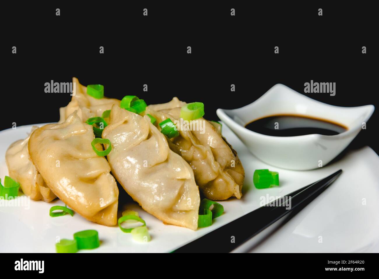 Traditional Japanese gyoza dumplings with soy sauce and chopsticks ...