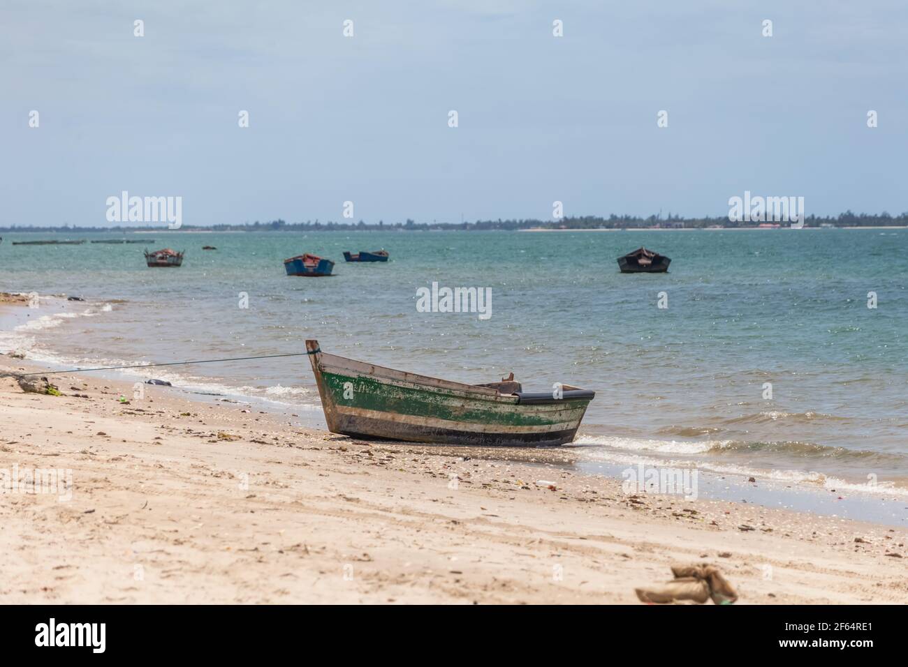 View of traditional fishing boats floating on the edge of the Luanda ...