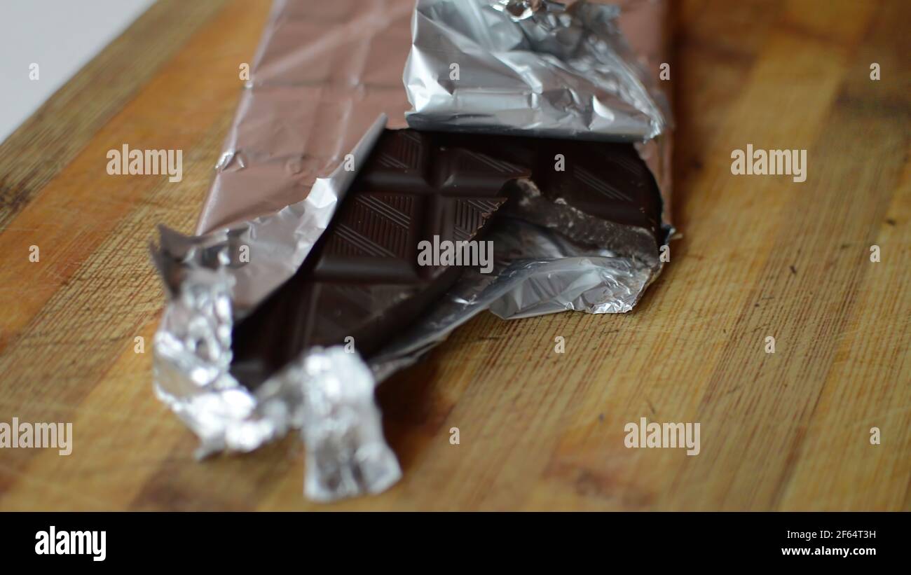 silver paper wrapped chocolate bars Stock Photo - Alamy