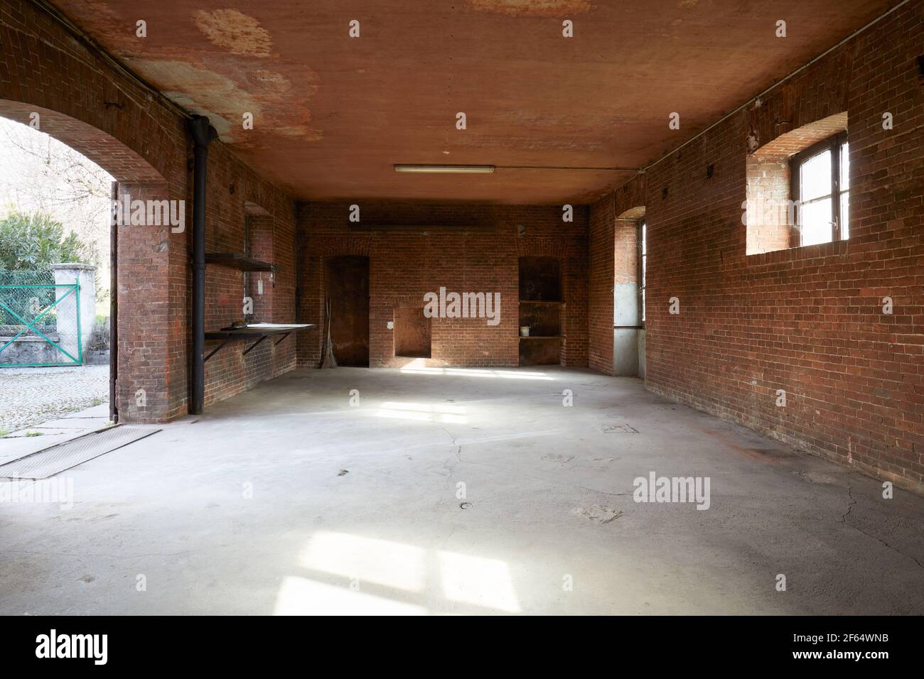 Old, empty workshop interior with brick walls Stock Photo - Alamy