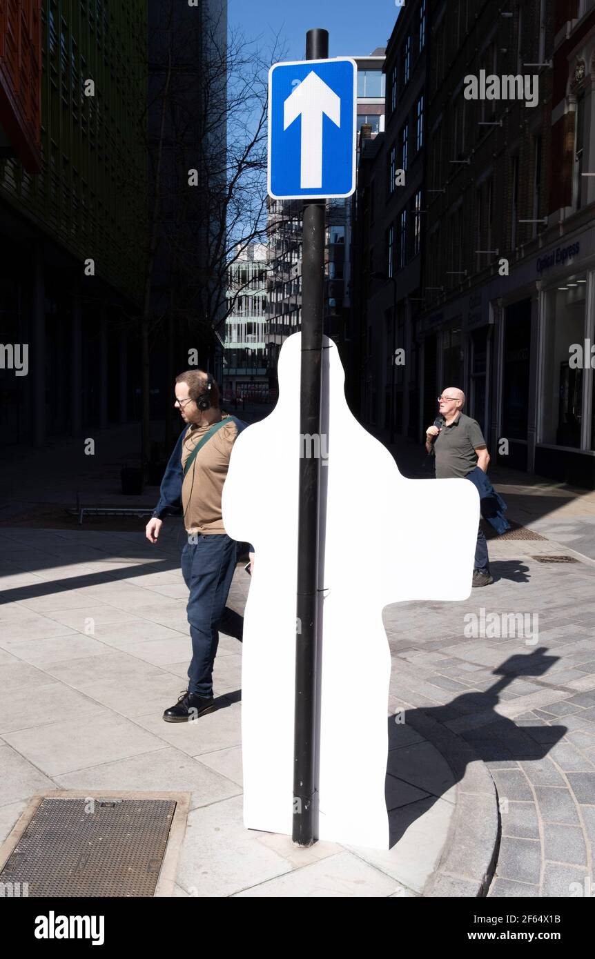 The reverse side of a construction site warning sign appears as a white ...