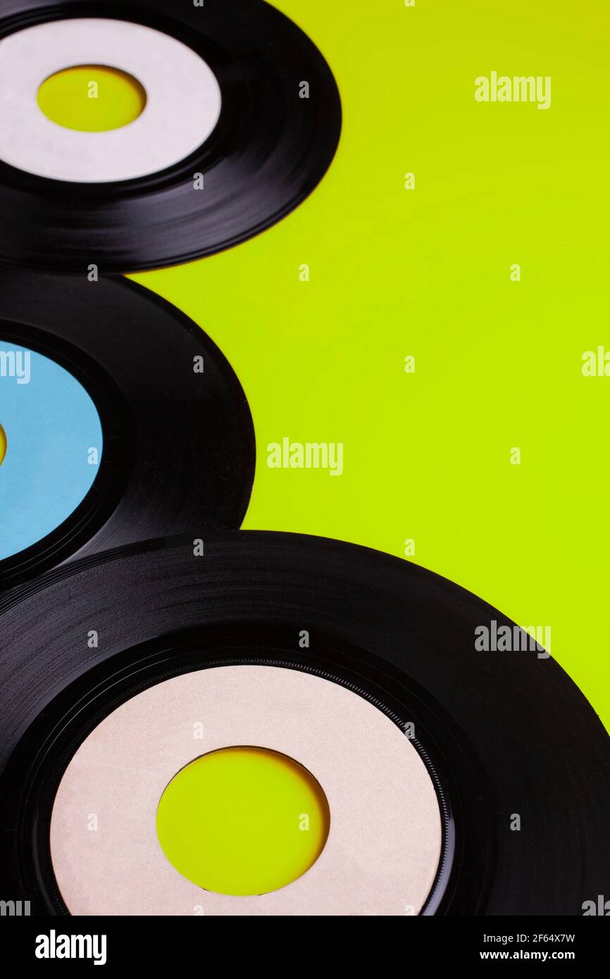 Old Vinyl 45 rpm Records on green background Stock Photo - Alamy