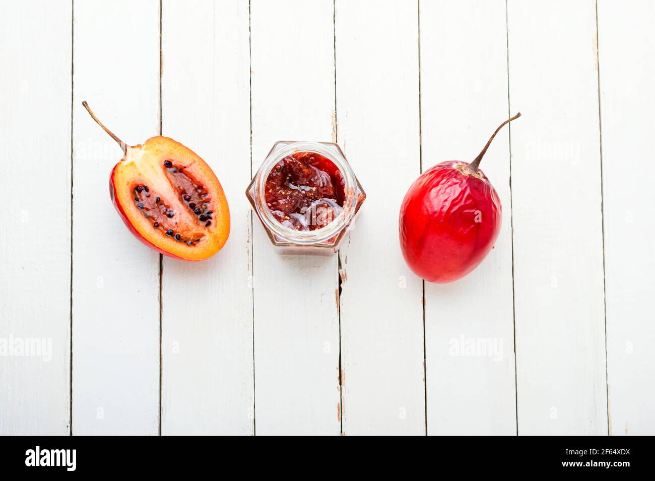 Delicious exotic tamarillo jam in a glass jar Stock Photo - Alamy