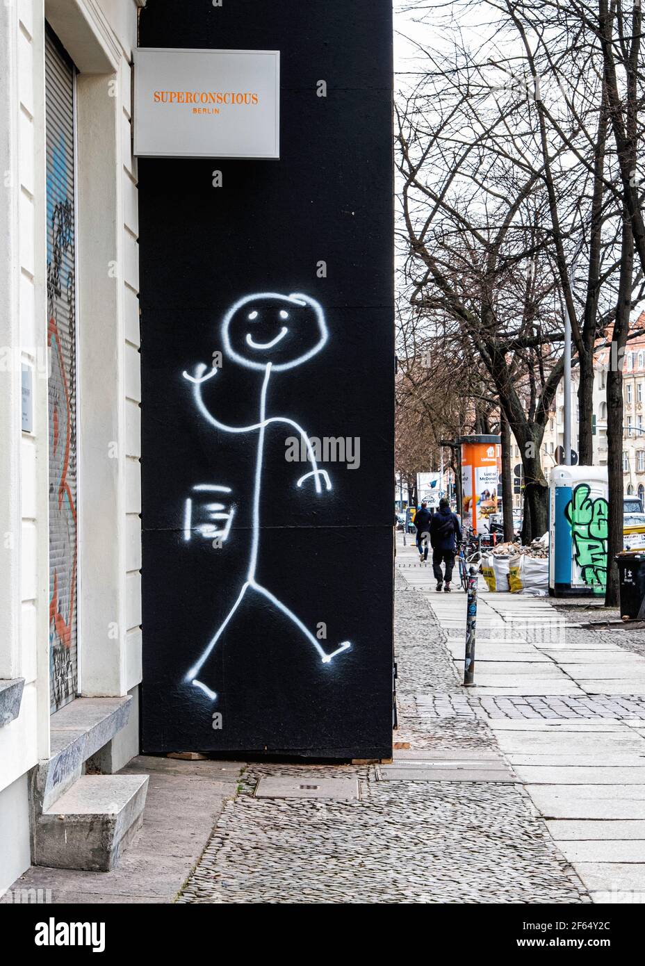 Street view, Supersconscious store sign, drawing of stick man and ...