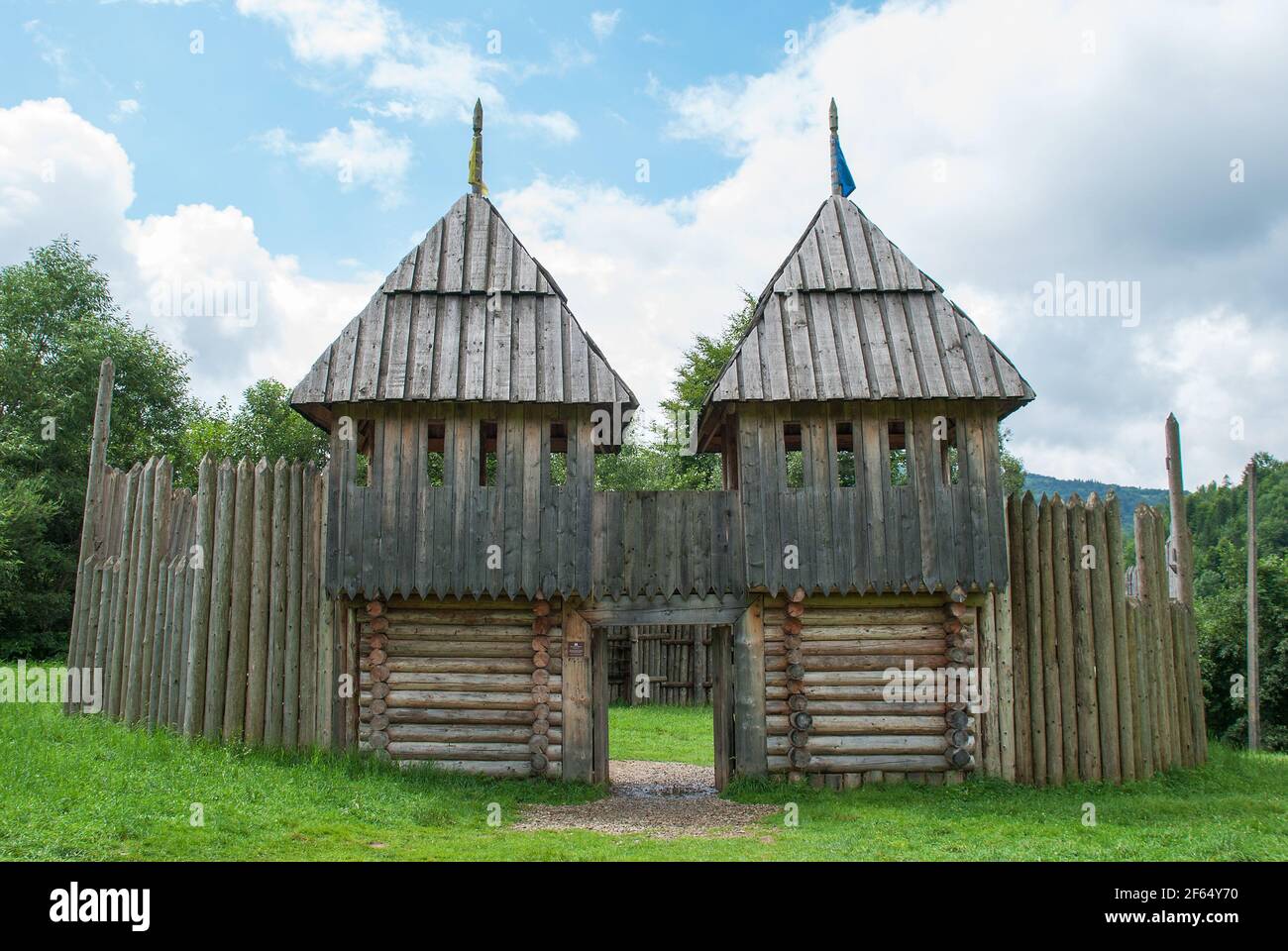 Wooden fortress towers, reconstruction of old battles, forest lawn ...