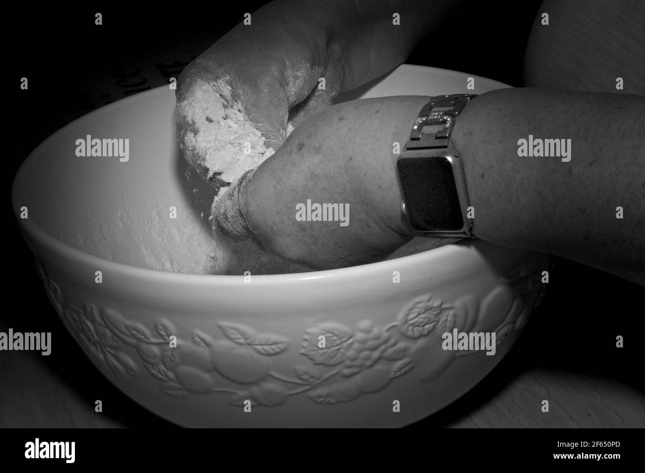 Hand mixing flour Stock Photo - Alamy