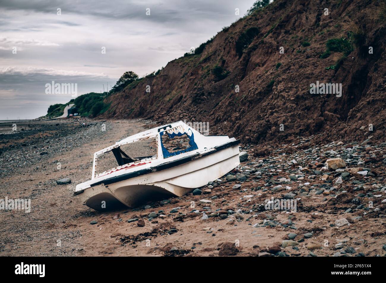 Old rusty boat on Thurstaston beach during low tide Stock Photo - Alamy