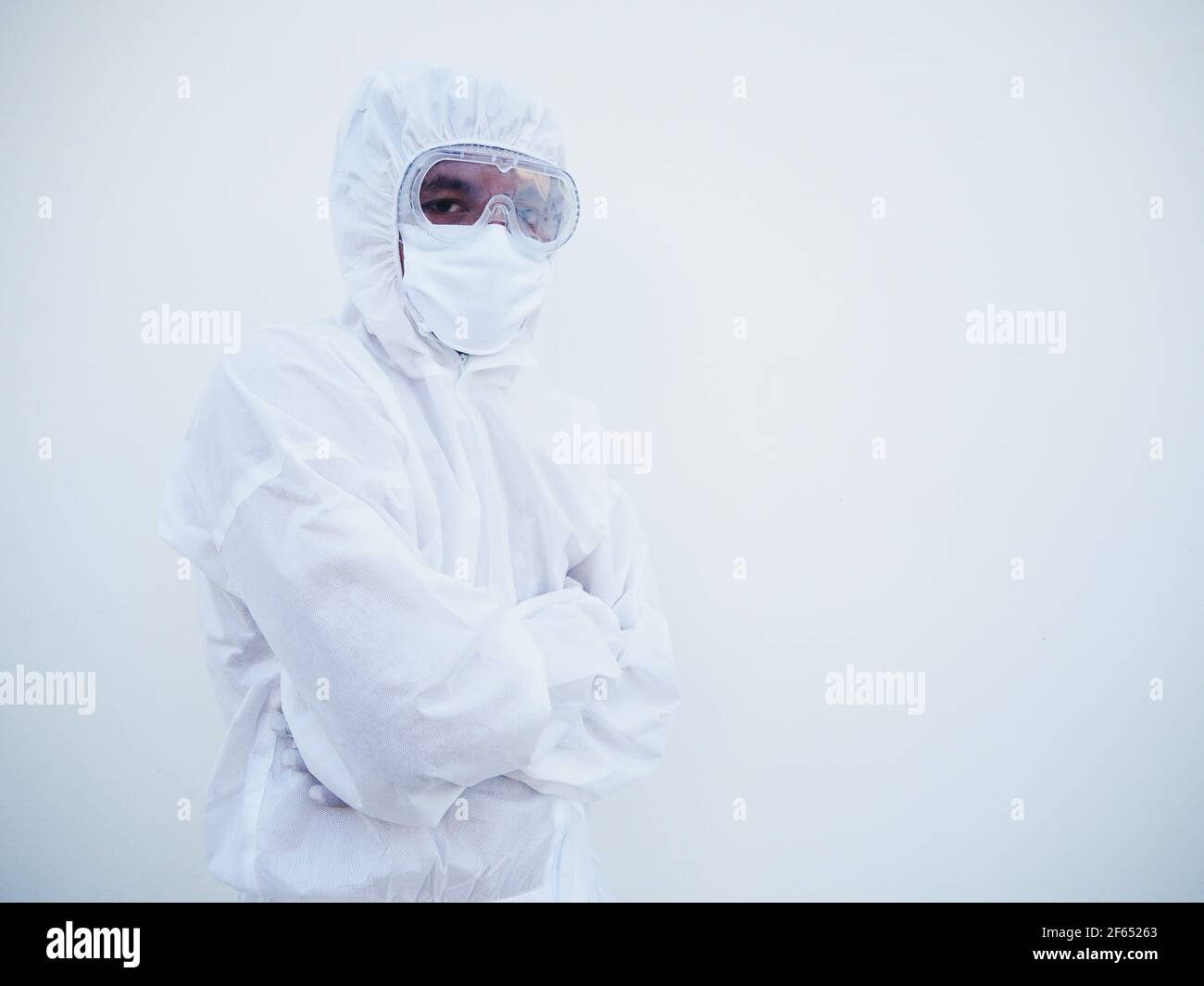 Portrait of confident asian male doctor or scientist in PPE suite ...