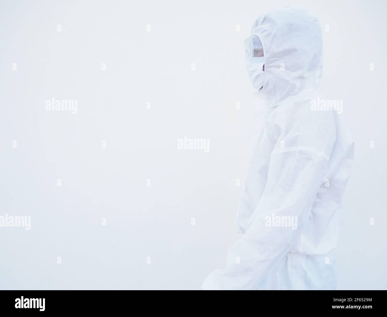 Side view doctor or scientist in PPE suite uniform standing with like ...