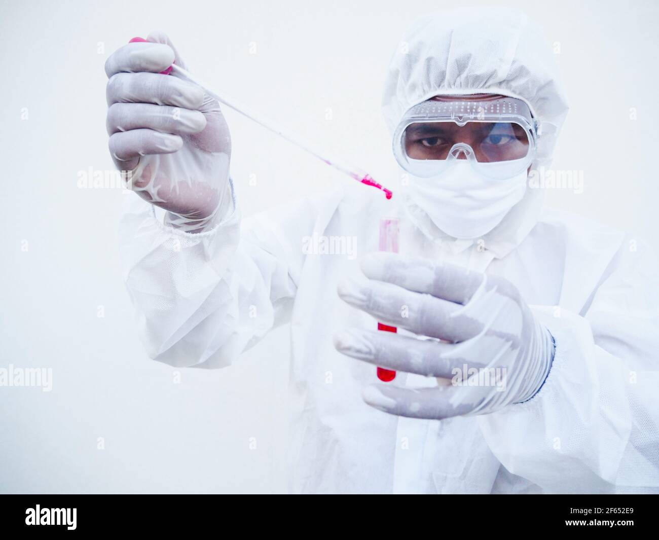 Asian doctor or scientist in PPE suite uniform. Personal protective ...