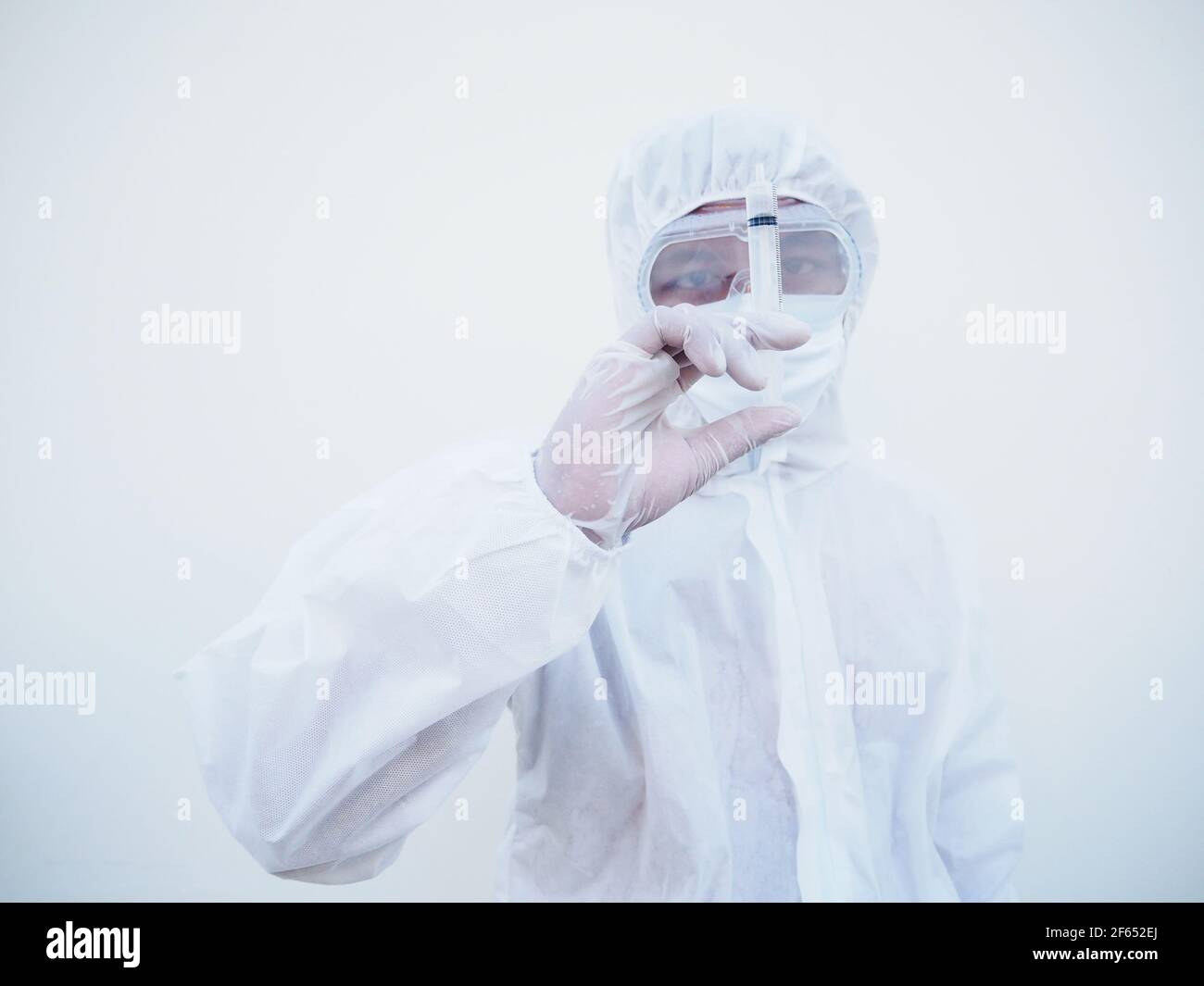 Asian doctor or scientist in PPE suite uniform holding medical ...