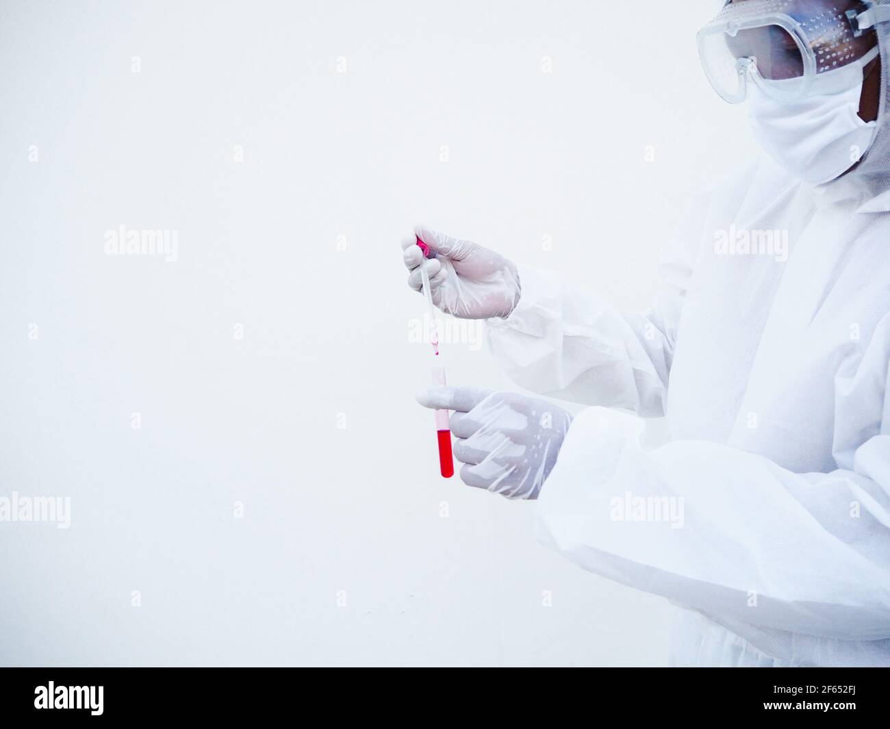 Asian doctor or scientist in PPE suite uniform. Personal protective ...