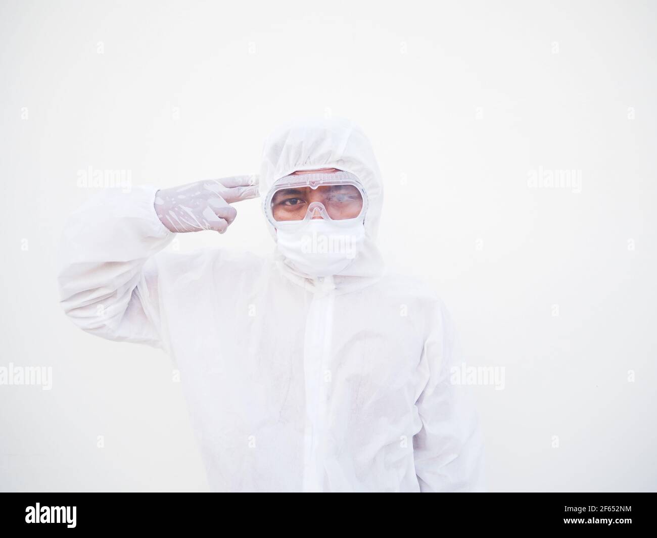 Doctor or scientist in PPE suite uniform showing hand like gun in to ...