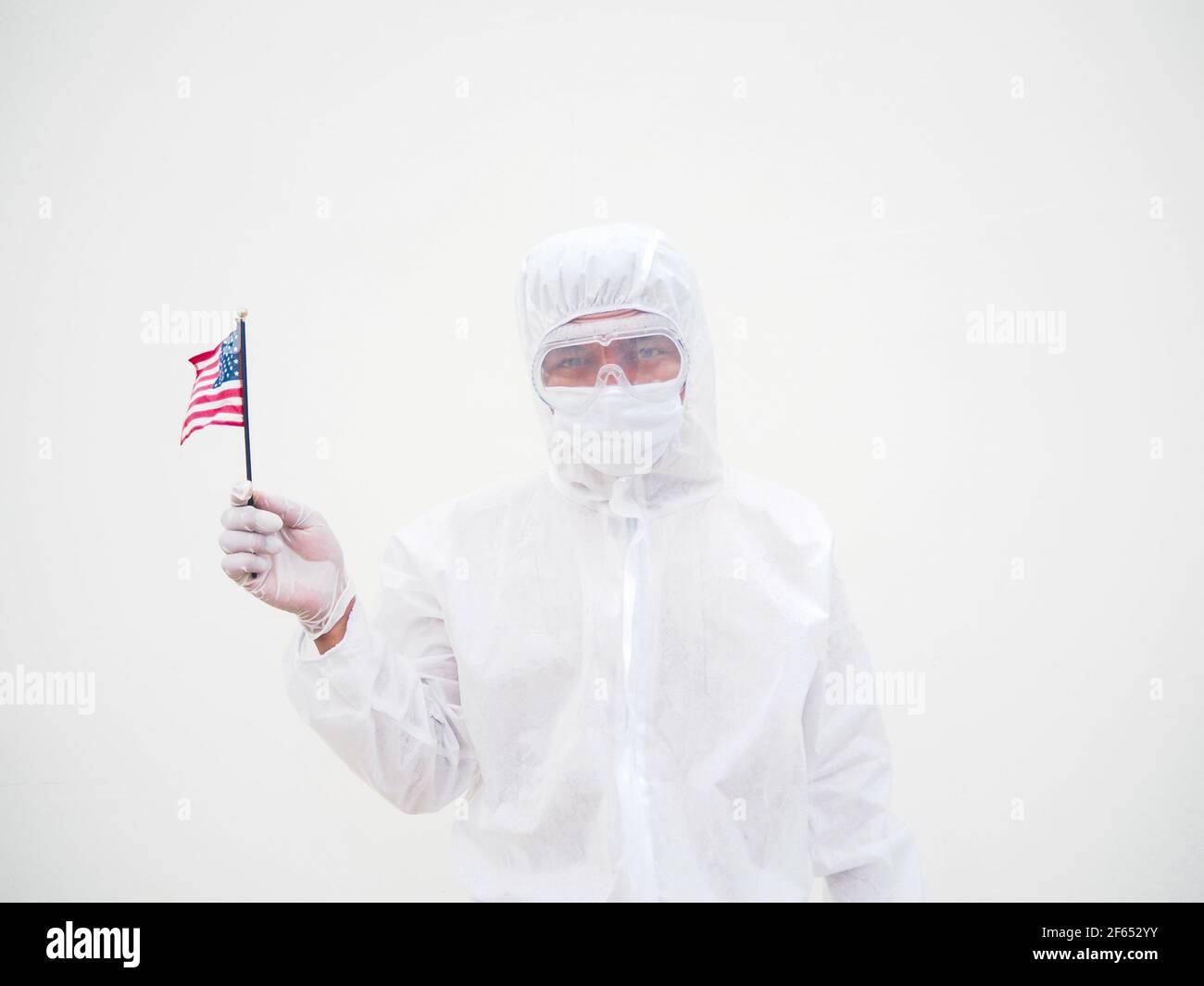 Portrait of doctor or scientist in PPE suite uniform holding national ...