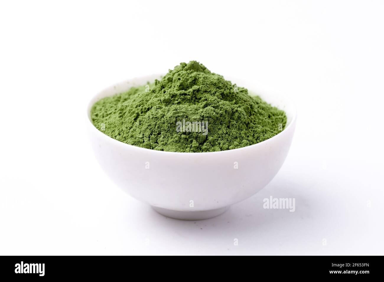 Green Barley Sprout grass and bowl of green detox powder isolated on ...
