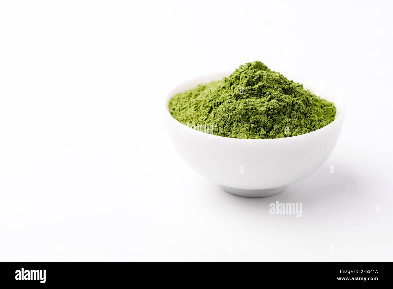 Green Barley Sprout grass and bowl of green detox powder isolated on ...