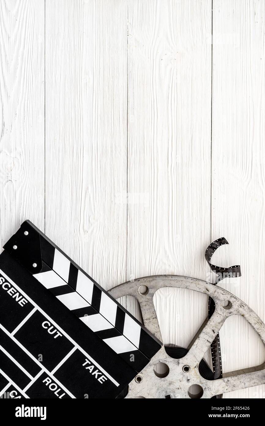 Motion picture film reel with movie clapper. Cinema concept Stock Photo ...