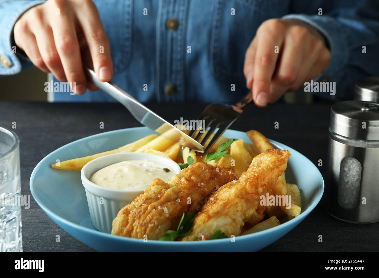 Woman eating fish and chips hi-res stock photography and images - Alamy