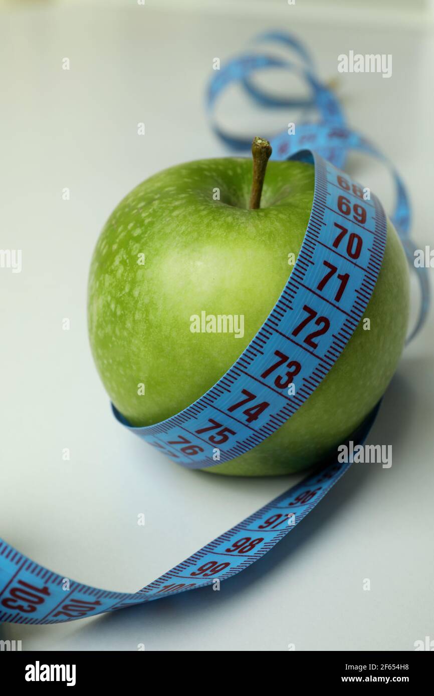 Apple on top measuring hi-res stock photography and images - Alamy