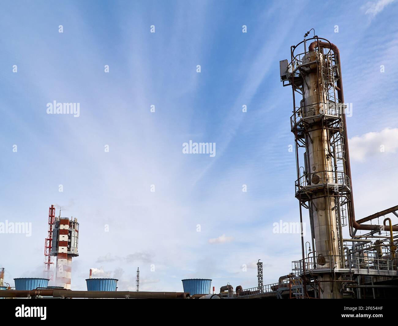 Oil refinery chemical plant bottom view with copyspace over blue ...