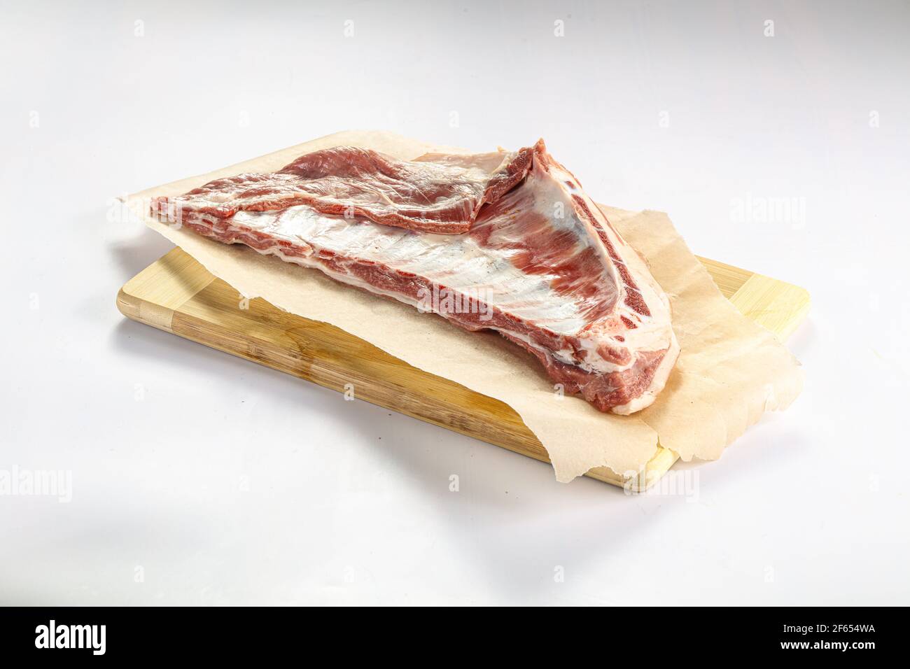 Raw lamb loin rack chop isolated Stock Photo - Alamy