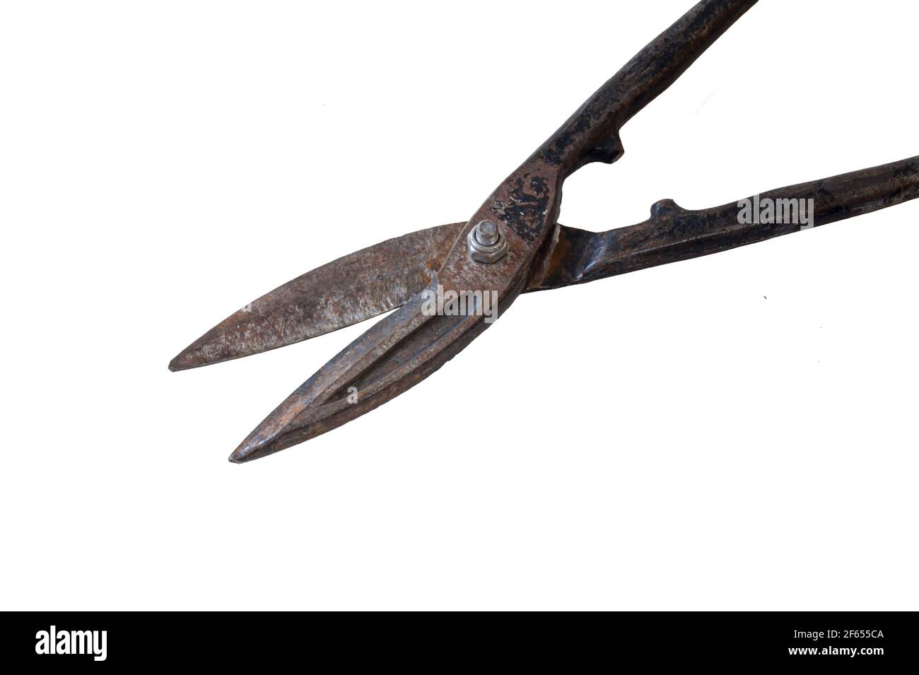 Rusty metal scissors lie on the table. Metal tools isolated on a white ...