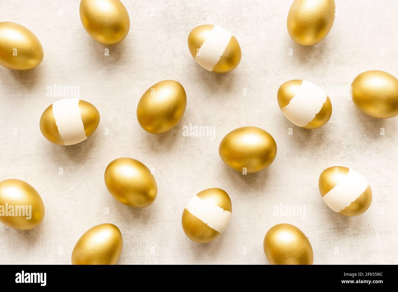 Pattern of golden eggs. Easter decoration. Wealth and good luck concept ...