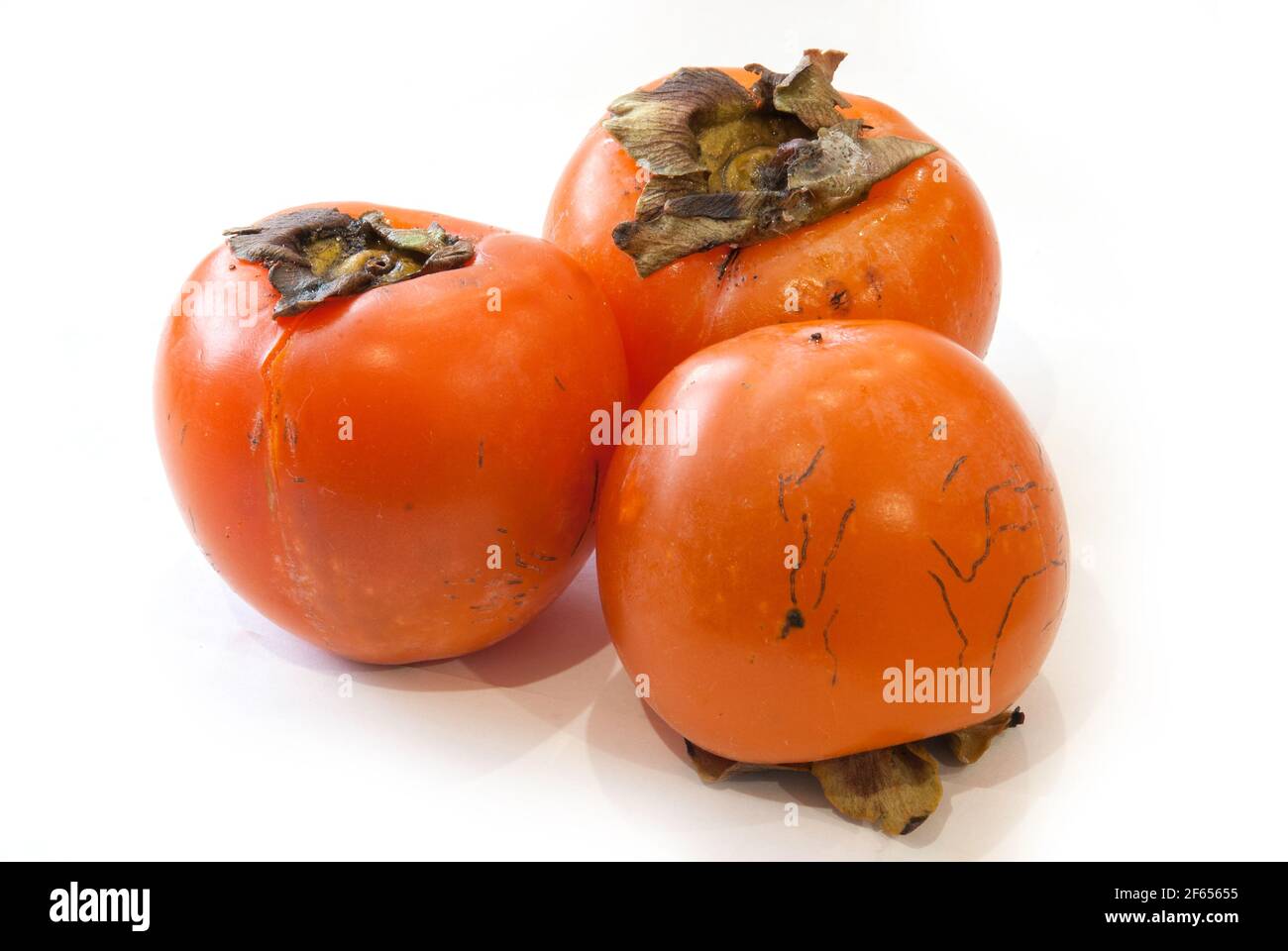 fresh ripe persimmons isolated on white background Stock Photo - Alamy