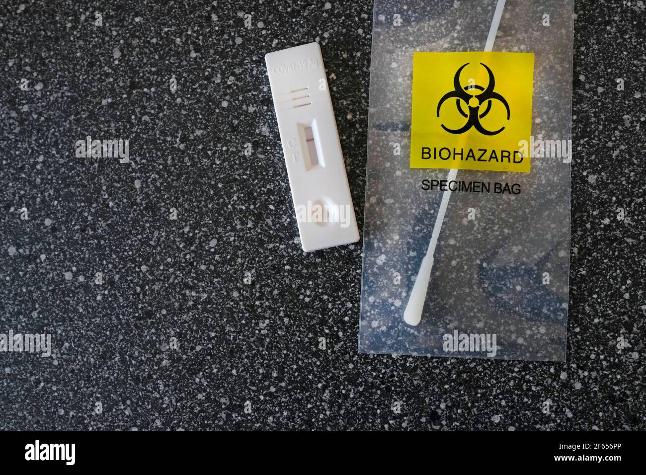 Coronavirus (COVID-19) rapid test with negative result next to a nasal ...